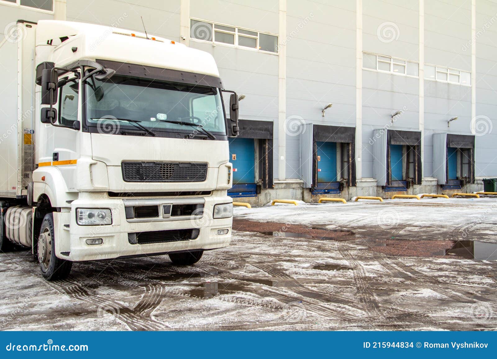 Truck while Loading in a Big Distribution Warehouse with Gates for for ...