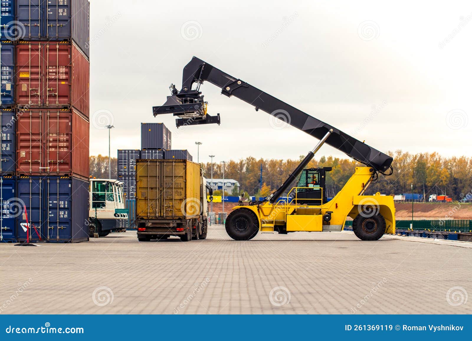 Truck while Loading in Logistic Shipping Yard with Cargo Container ...