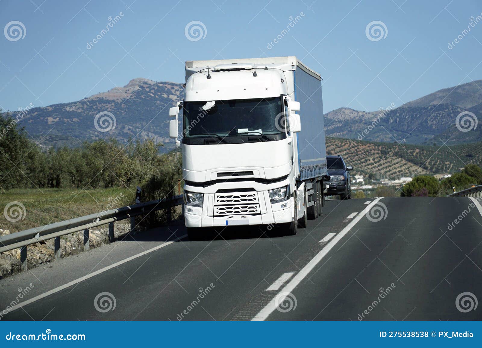 Truck on a Road - Front View, Mountains on Second Plan Stock Photo ...