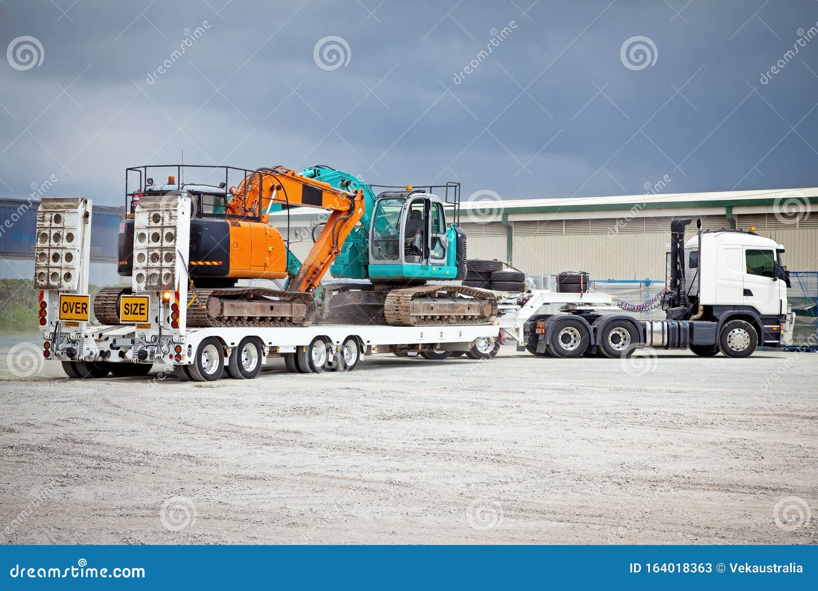 Truck Towing Hydraulic Excavators on Float Trailer Stock Image - Image ...