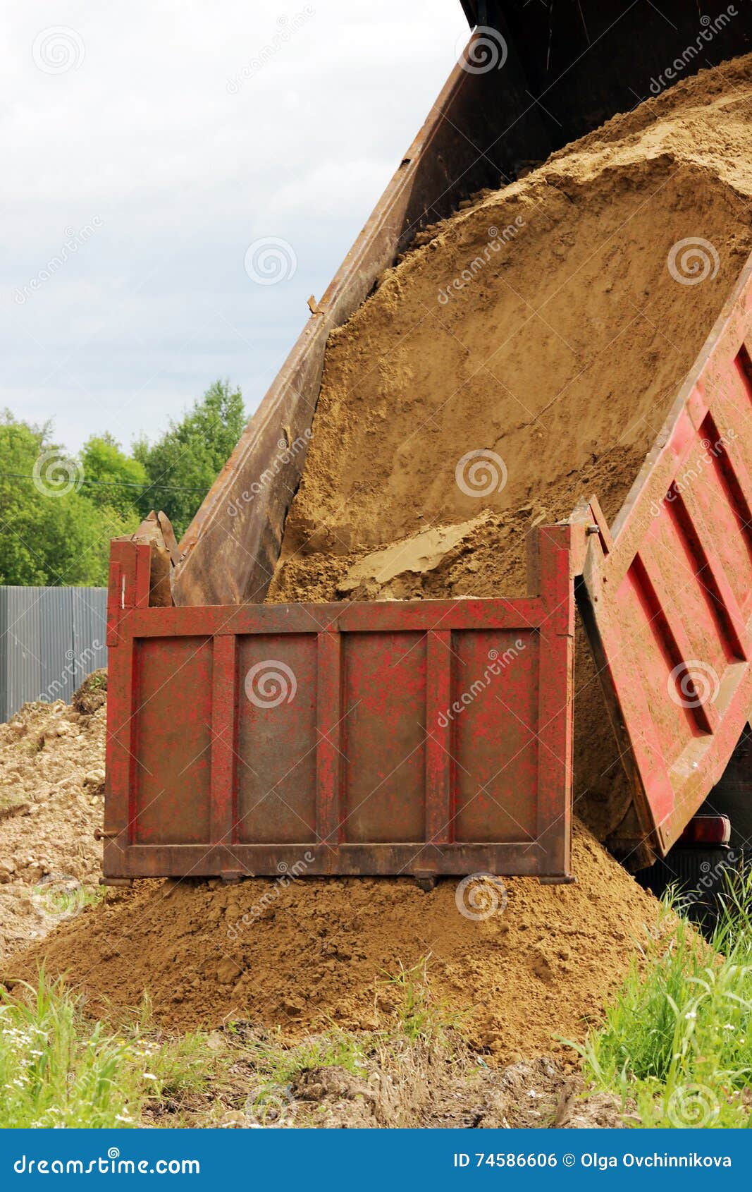 Truck Unloads Sand for Backfilling Trenches with the Pipeline after the ...