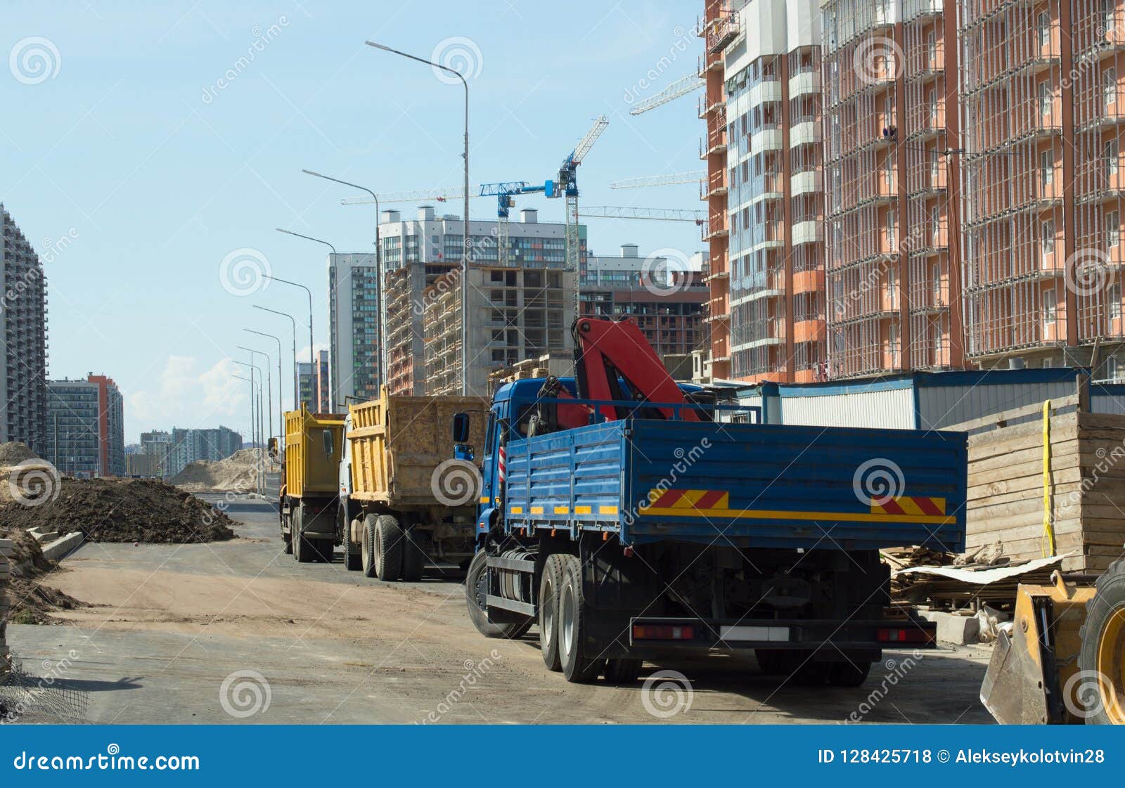 Trucks, Construction Machinery and High-rise Cranes on the Construction ...