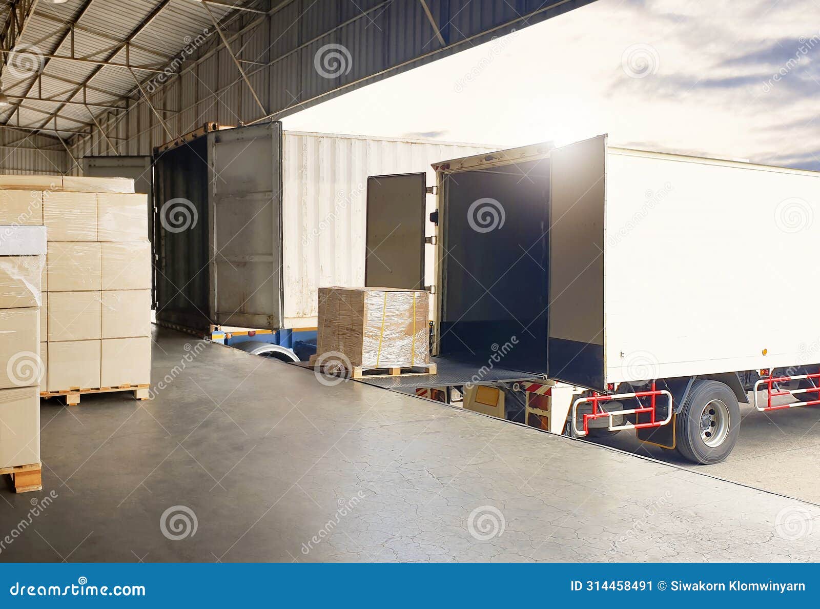 Trucks Loading Package Boxes Pallets at Dock Warehouse. Container ...
