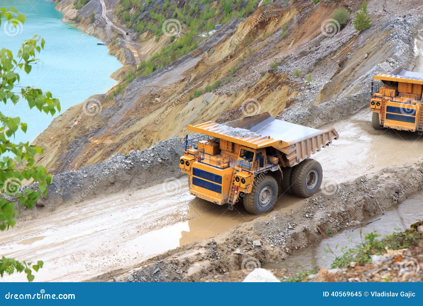 Trucks in open pit stock image. Image of industrial, lake - 40569645