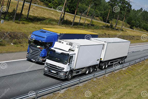 Trucks Overtaking on Highway Stock Image - Image of motorway, road ...