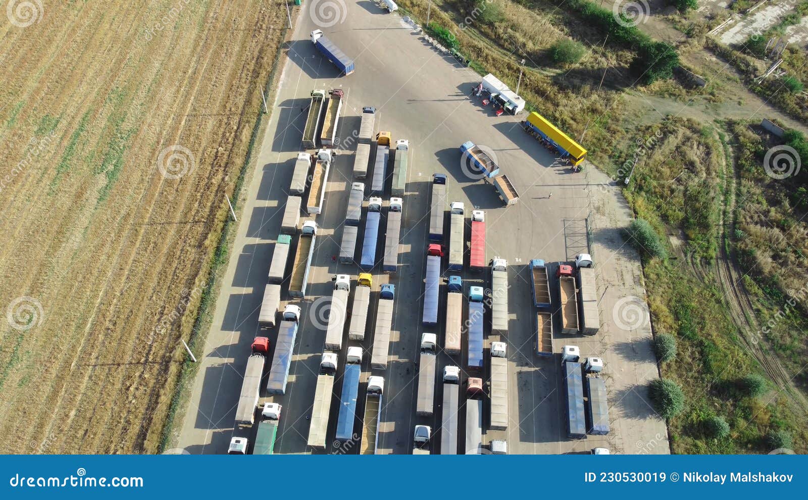 Trucks Stand in Line for Unloading. Terminal in the Port with Loaded ...