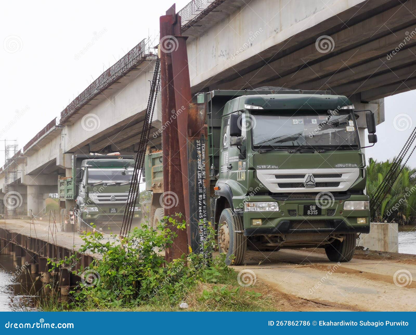 Trucks on Temporary Bridge. Construction of a Fly Over Bridge Road ...