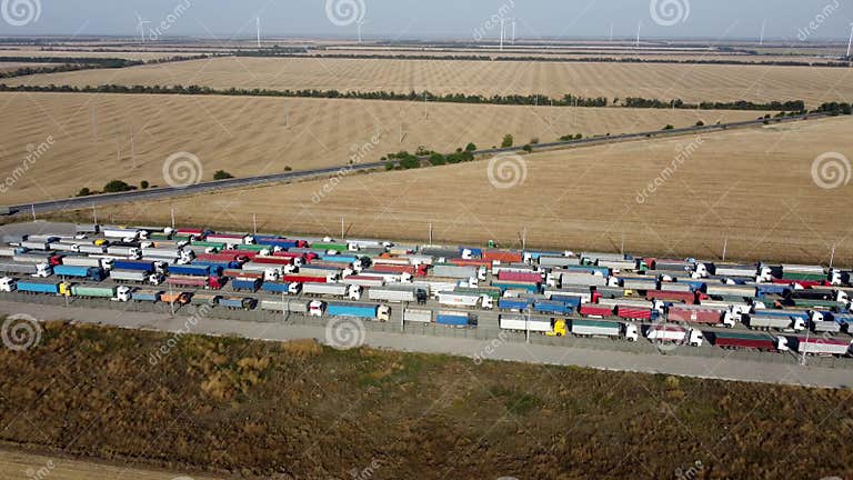 Trucks with Trailers Stand in a Long Queue at the Port Terminal for ...