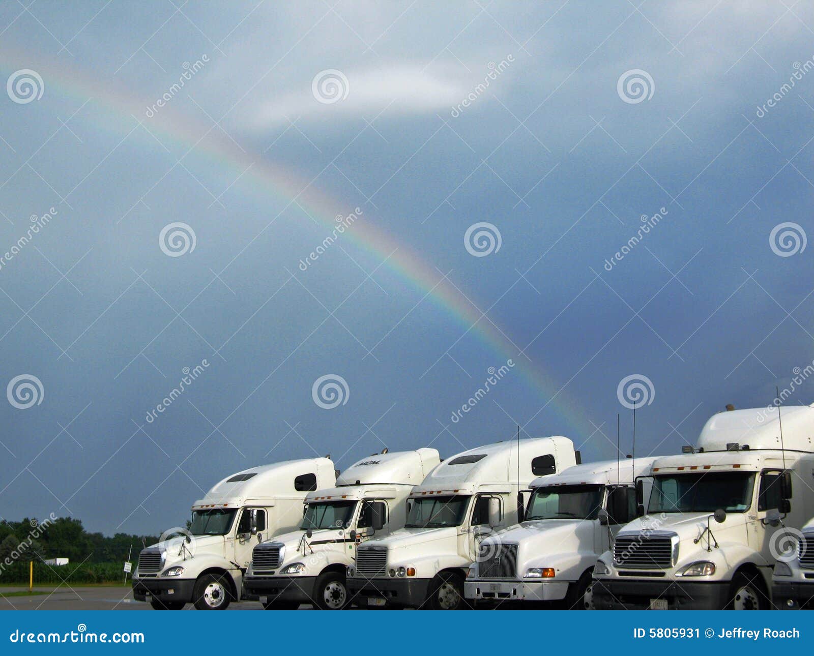 Trucks under a rainbow stock image. Image of trucks, rain - 5805931