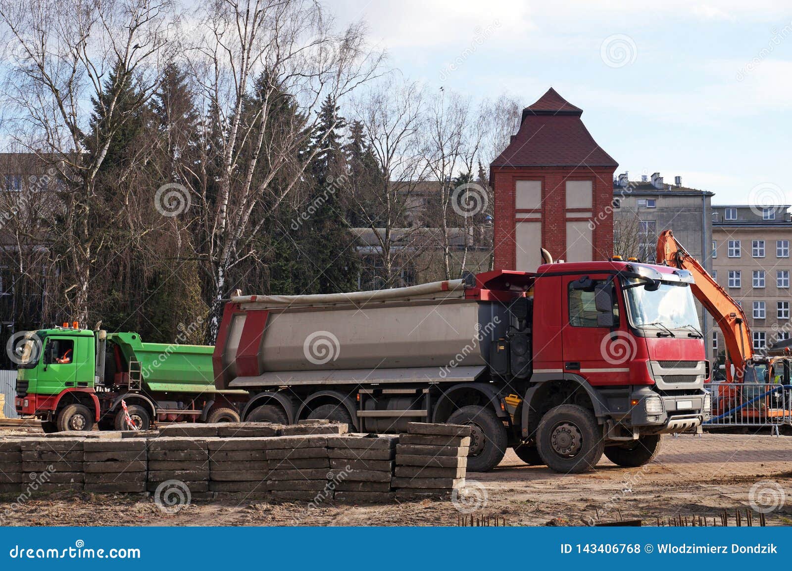 Trucks Waiting for the Earth To Be Loaded by the Excavator ...