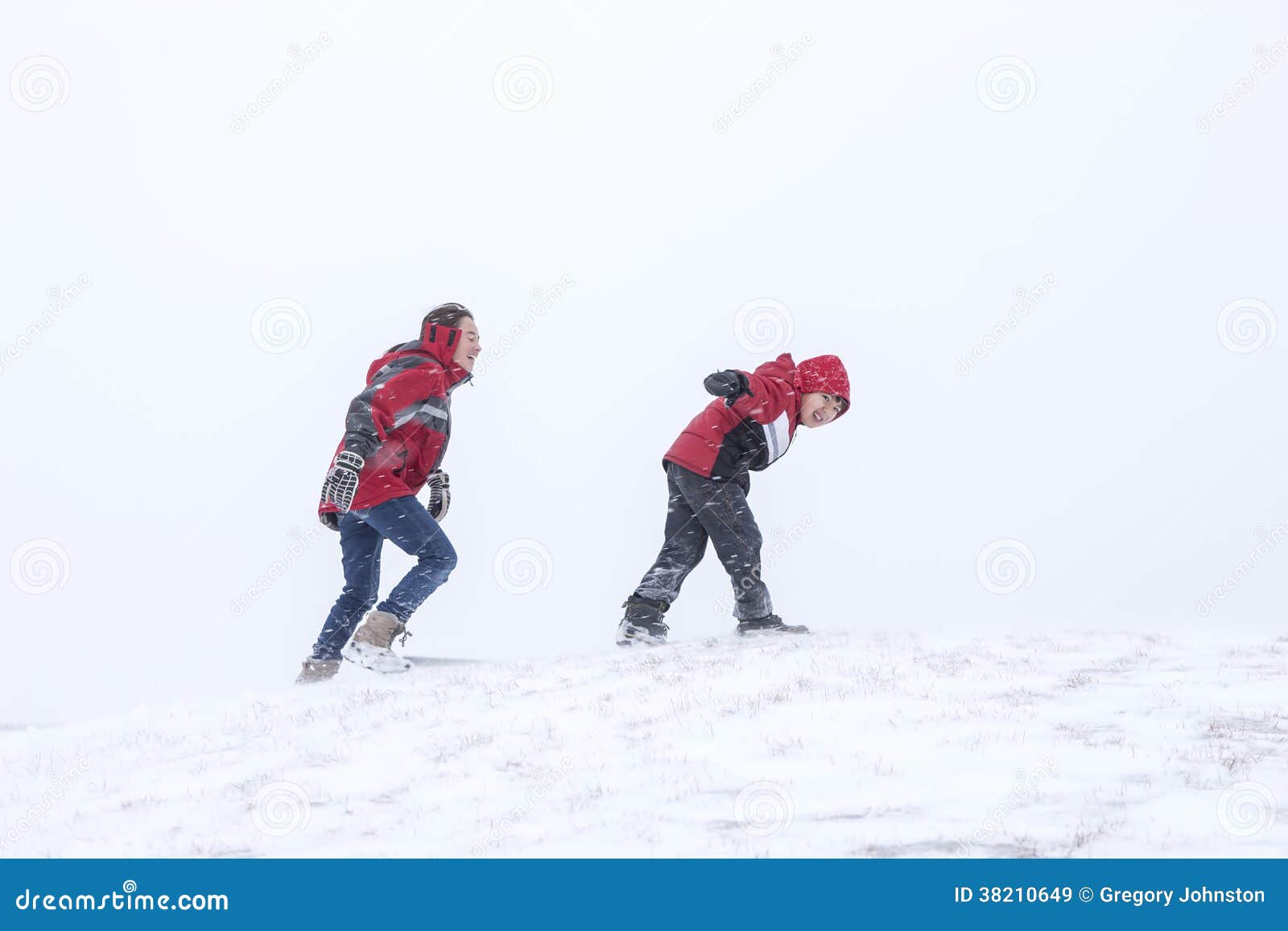 Young Man Trudging Through Snow With His Snowboard Royalty-Free Stock ...