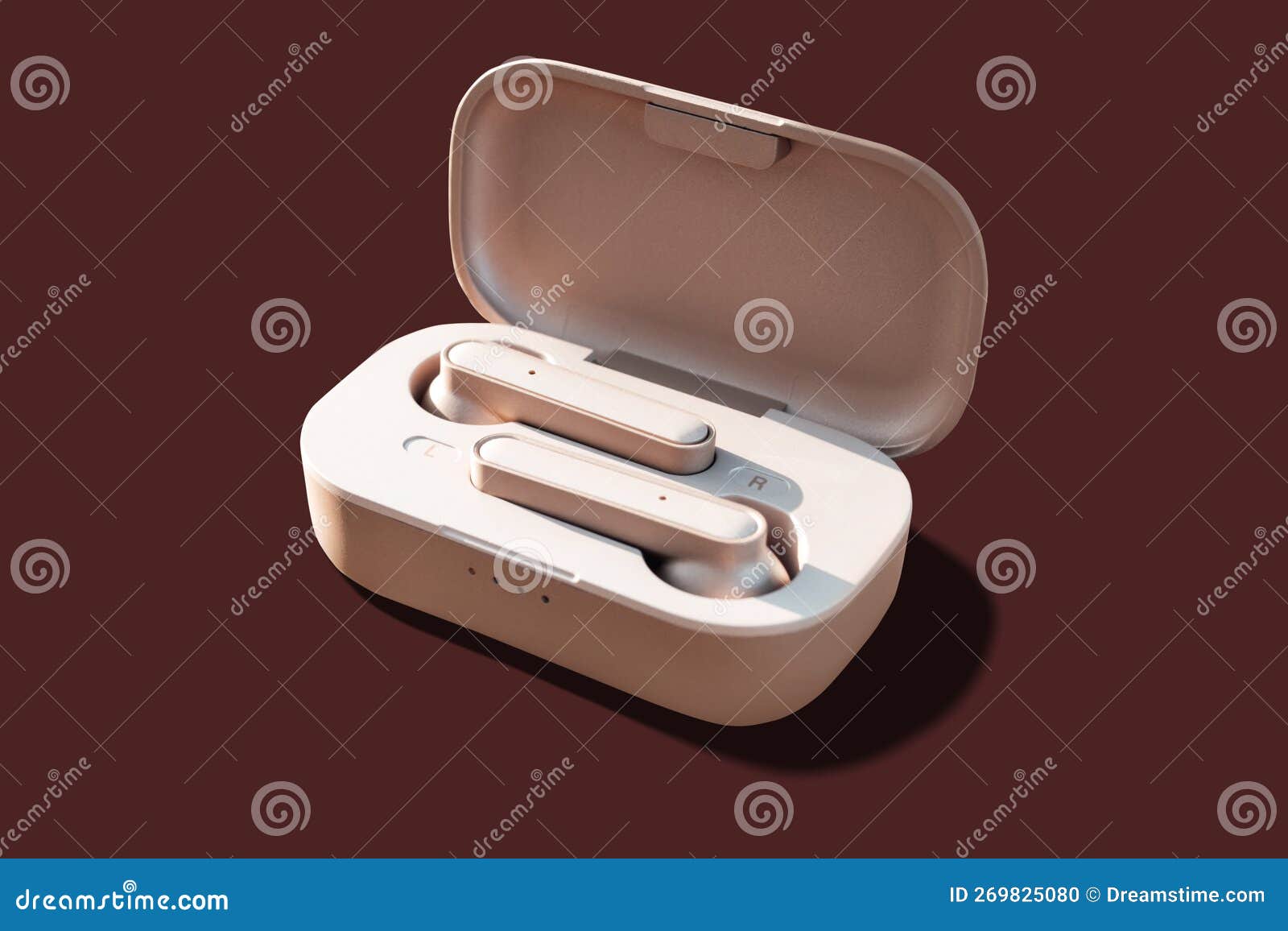 True Wireless Earbuds in Case on Natural Stone Background, Top View ...