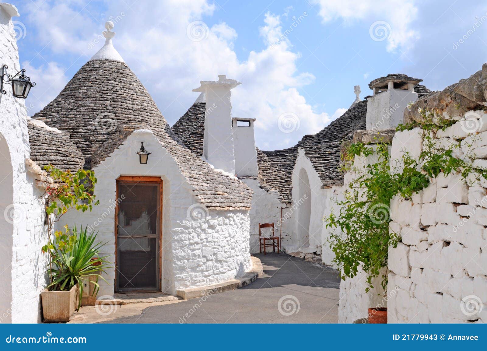 Trulli Houses in Alberobello, Italy Stock Image - Image of flowers ...