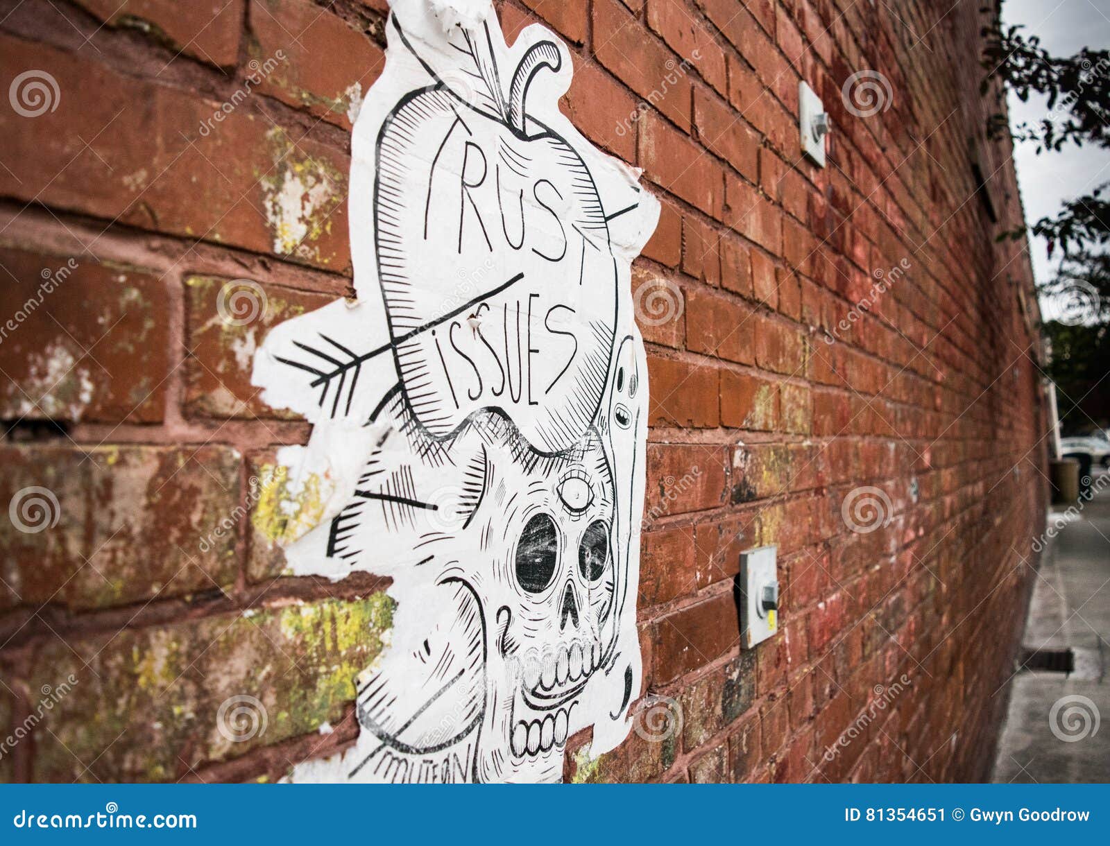 Trust Issues Graffiti on Brick Wall with Skull Editorial Photo - Image ...