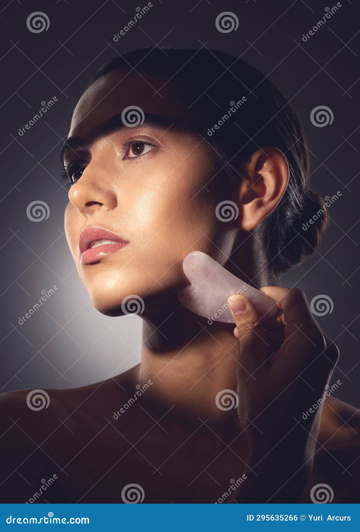 Trust the Process. Studio Shot of a Woman Using a Face Scraping Tool on ...