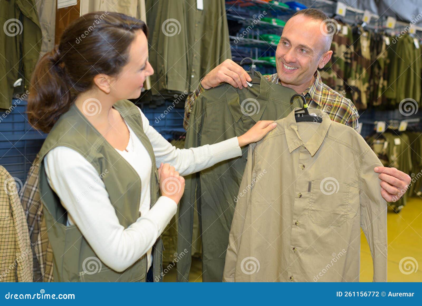 He trying on shirts stock photo. Image of assistant - 261156772