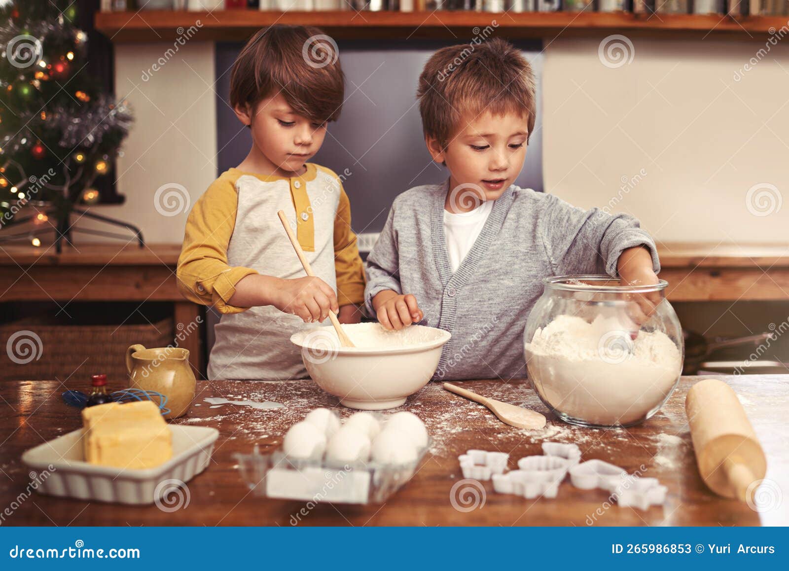 Trying Their Hand at Baking. Two Young Brothers Baking in the Kitchen ...