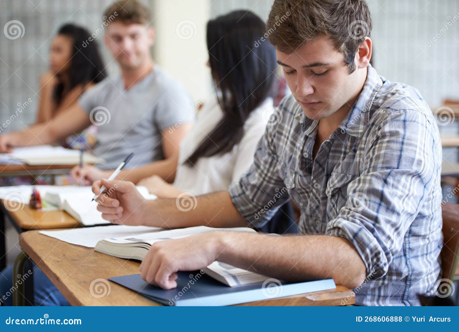 Trying To Get the Highest Grade. a Young College Student Studying in ...