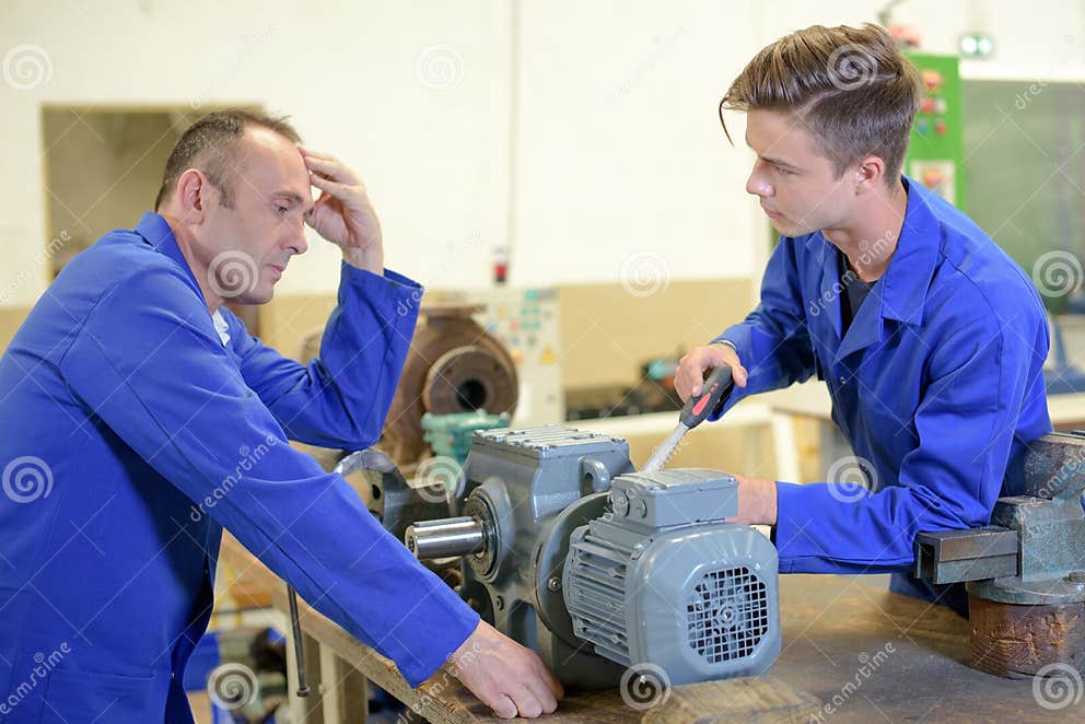 Trying To Solve Engine Problem Stock Image - Image of overalls, service ...