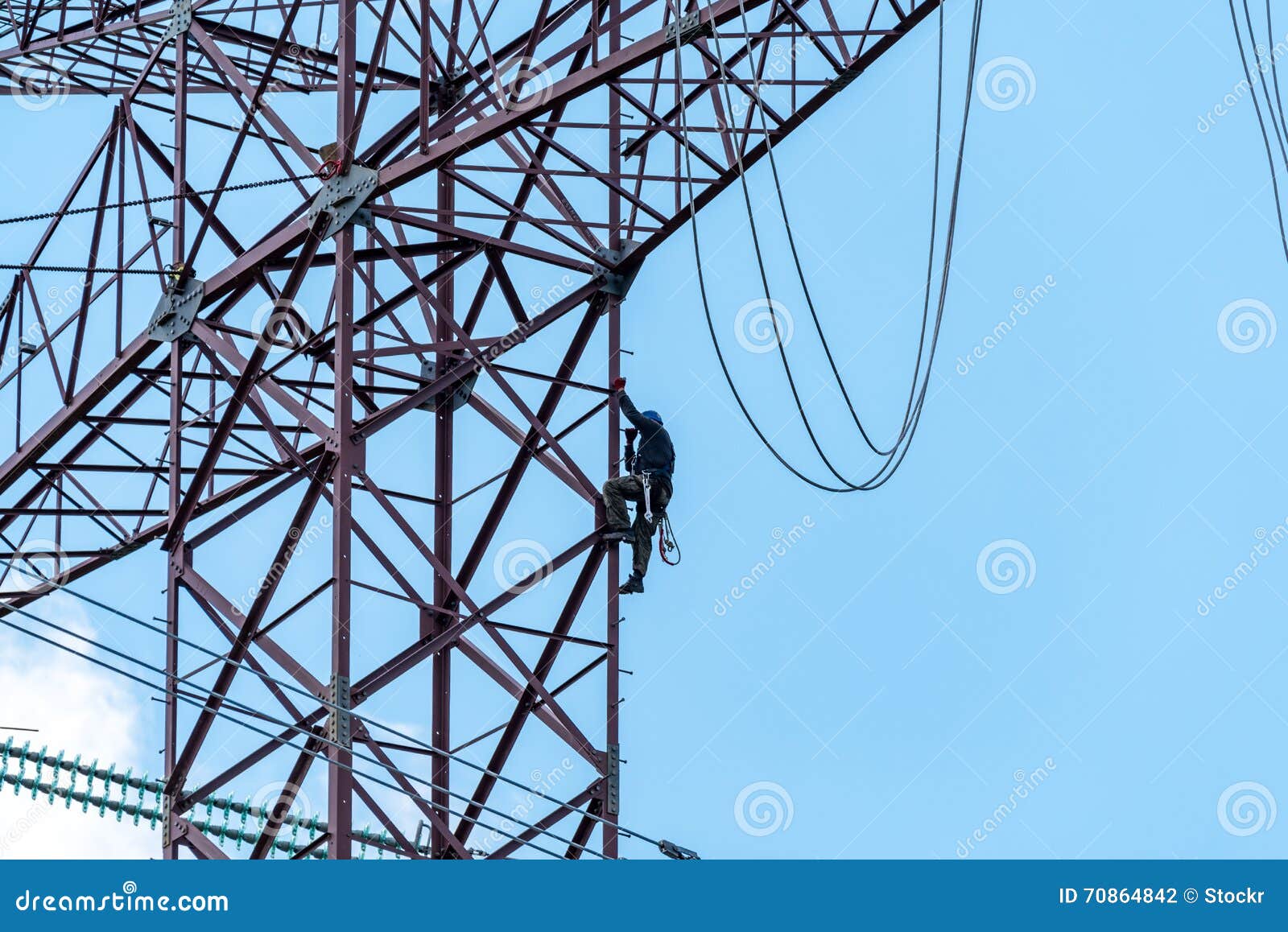 Tthe Worker Climbing on the High Dangerous Powerlines Stock Photo ...