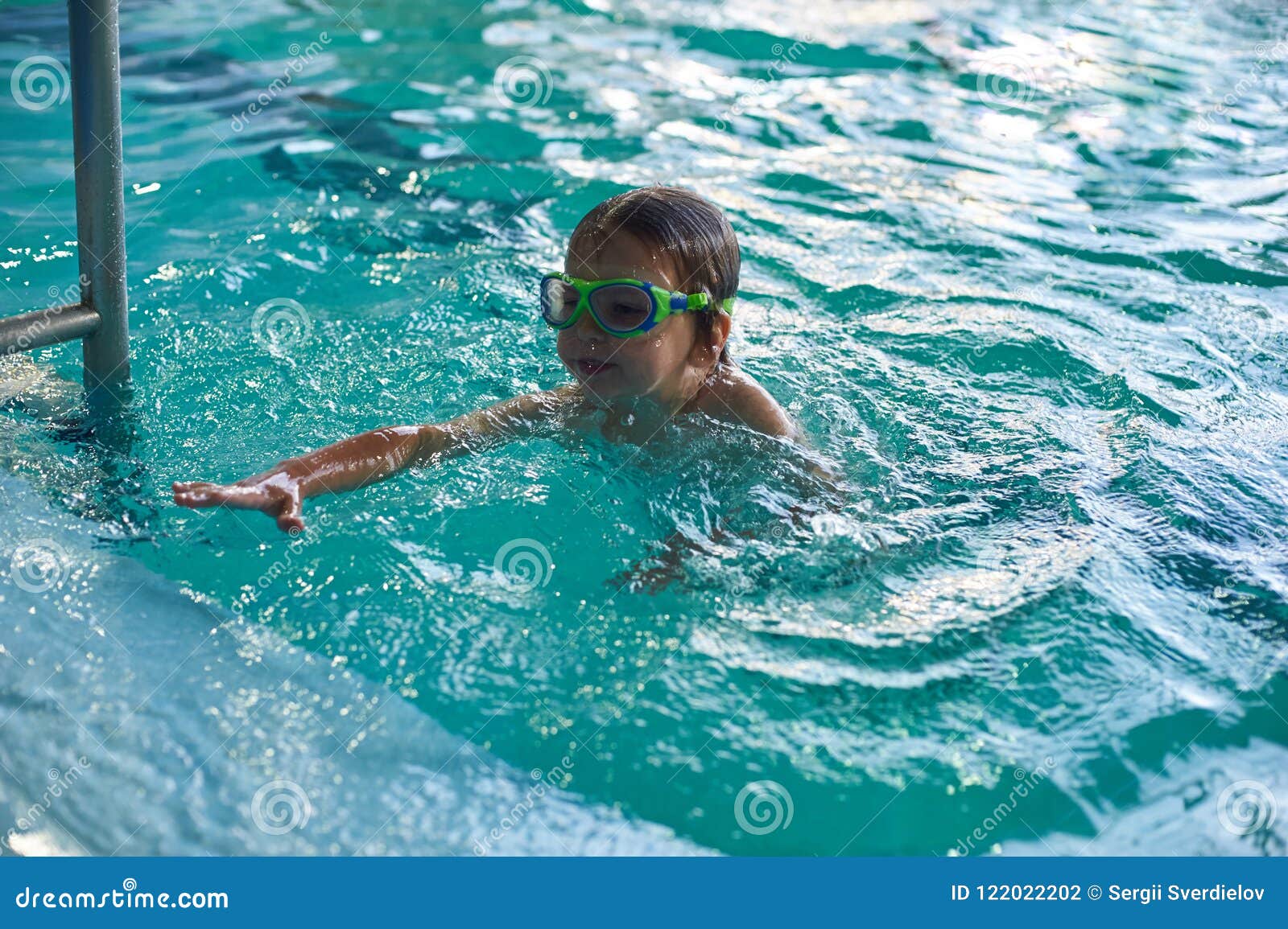 Little Smiling Boy Swims in the Pool. Close-up. Stock Photo - Image of ...