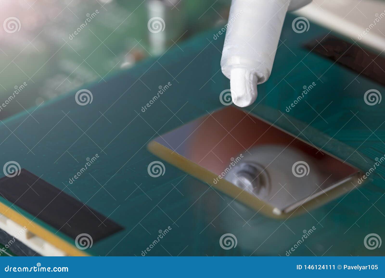 A Tube of Thermal Grease Over the Processor Chip Stock Image - Image of ...