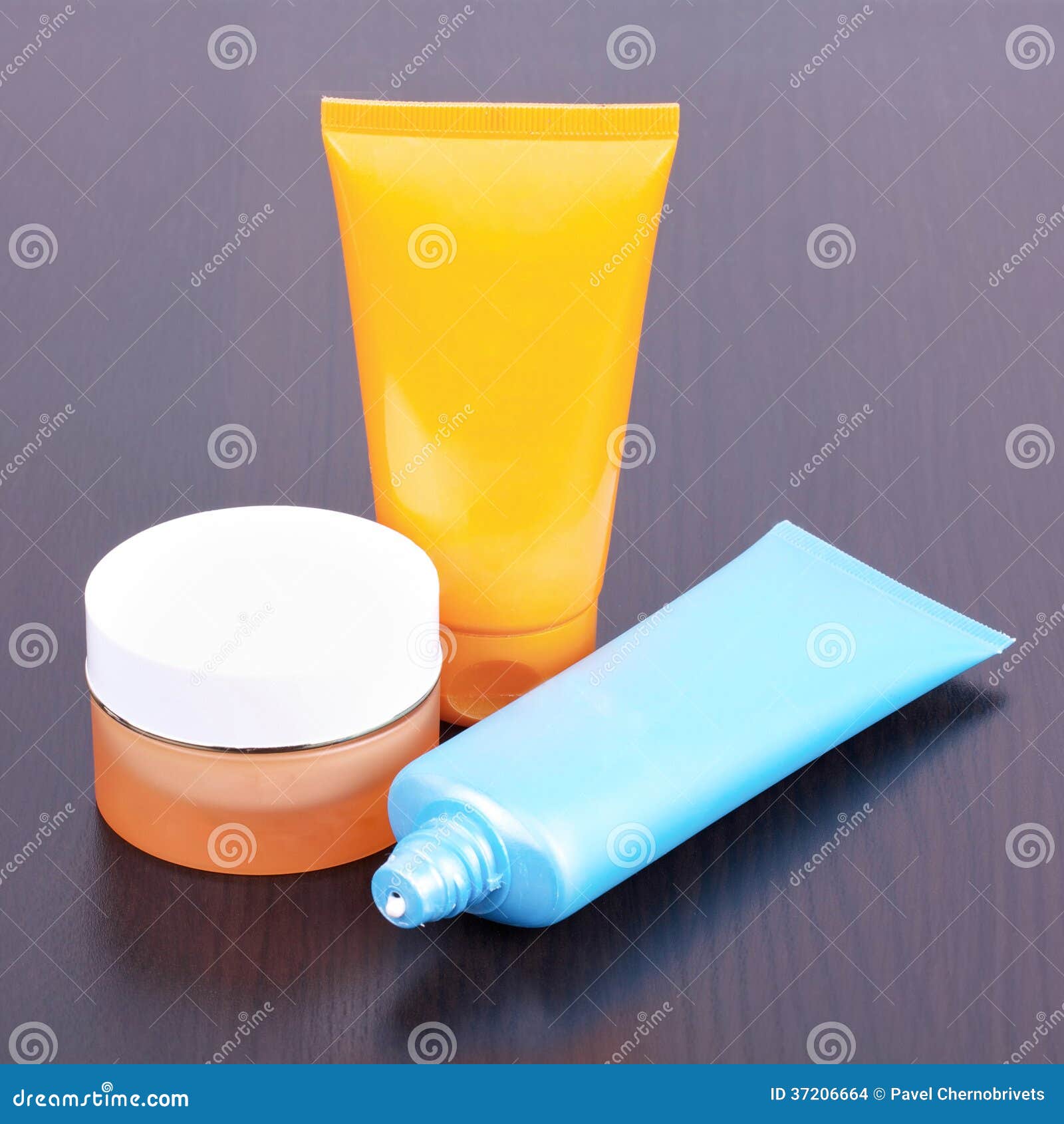 Tubes and Box with Cream on Black Table Stock Photo - Image of ...