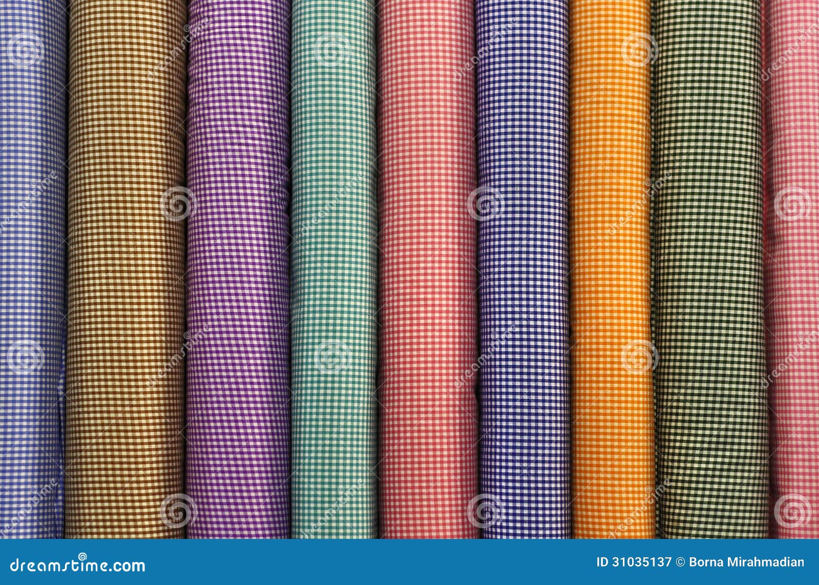 Tubes of Colorful Square Patterned Fabrics Stock Image - Image of stack ...