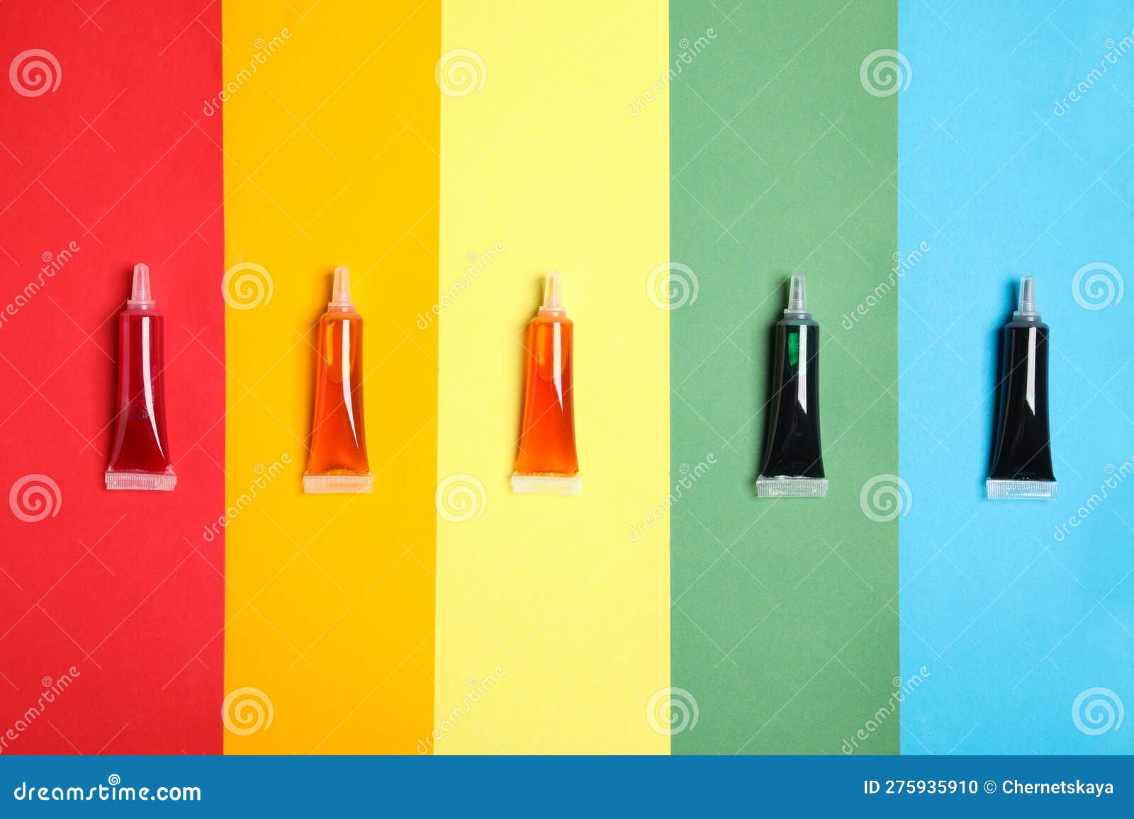 Tubes with Different Food Coloring on Rainbow Background, Flat Lay ...