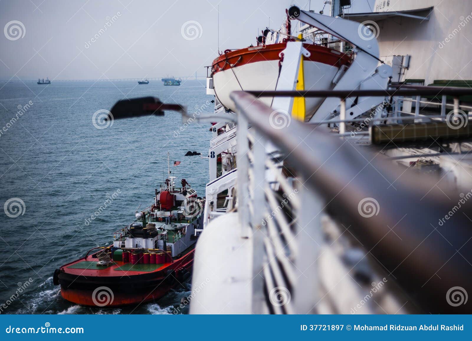 Tug boat towing ship stock image. Image of sailing, industry - 37721897