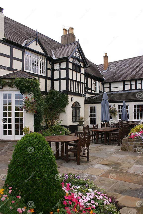 Tudor Courtyard 2 stock image. Image of quaint, flowers - 1496071