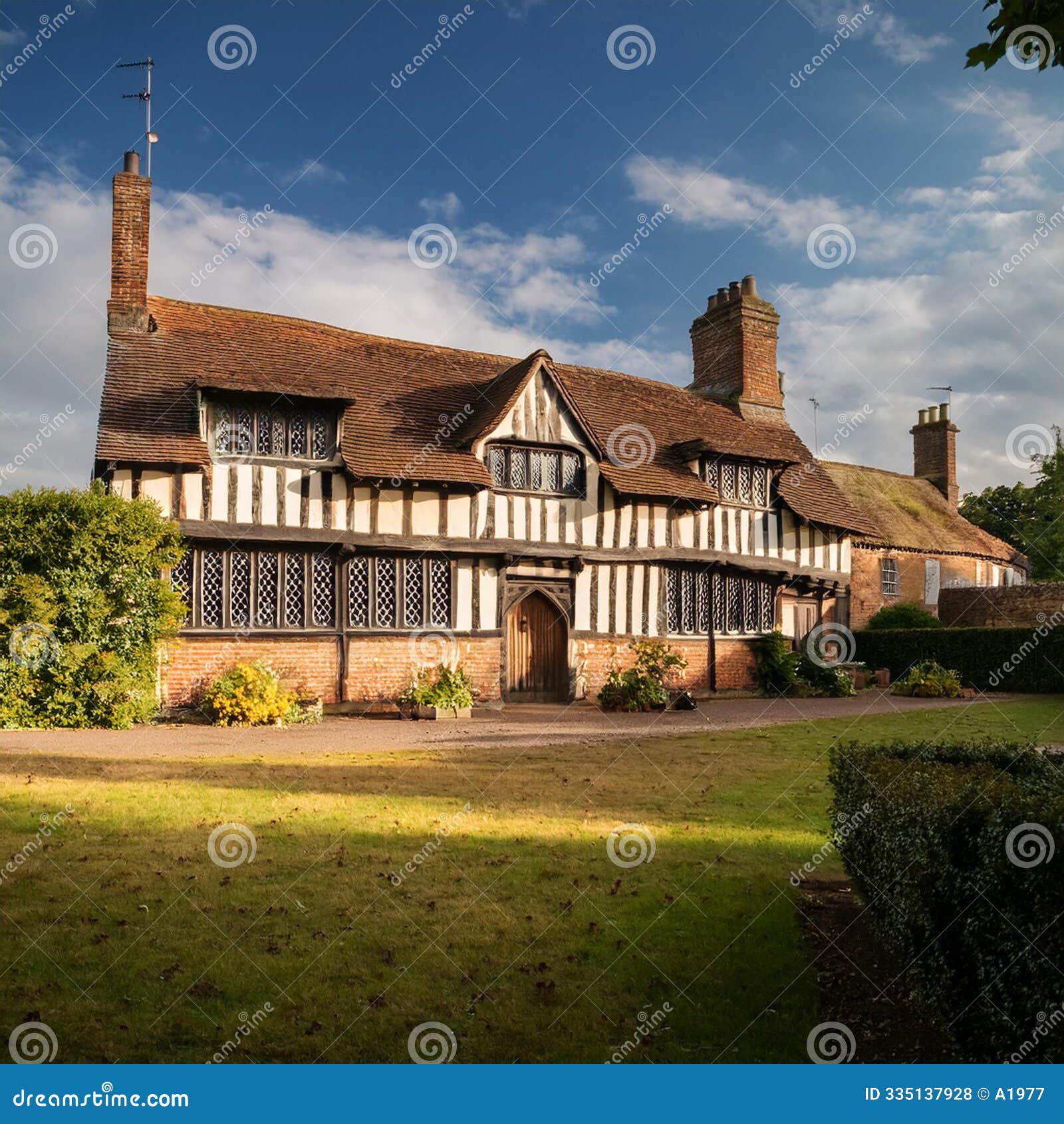 Tudor House Surrounded By Lush Greenery, With A Glimpse Of The Lake In ...