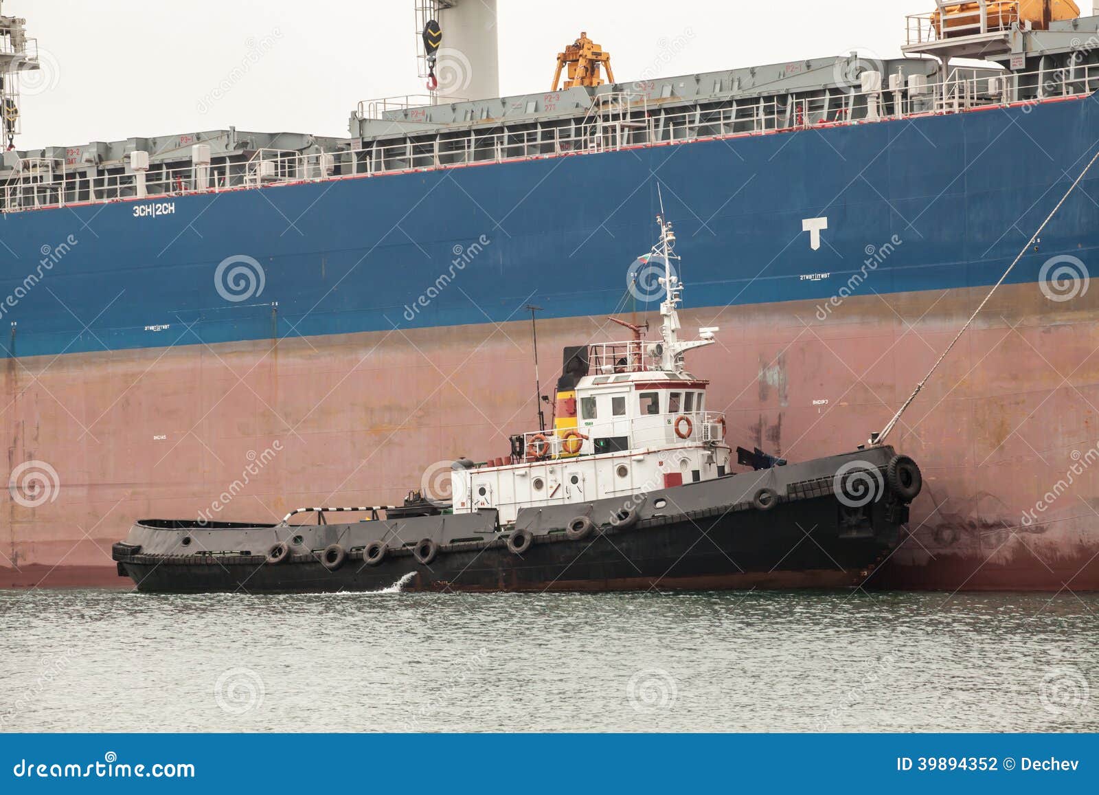 Tug Boat Assisting Huge Ship Stock Photo - Image of dock, transport ...