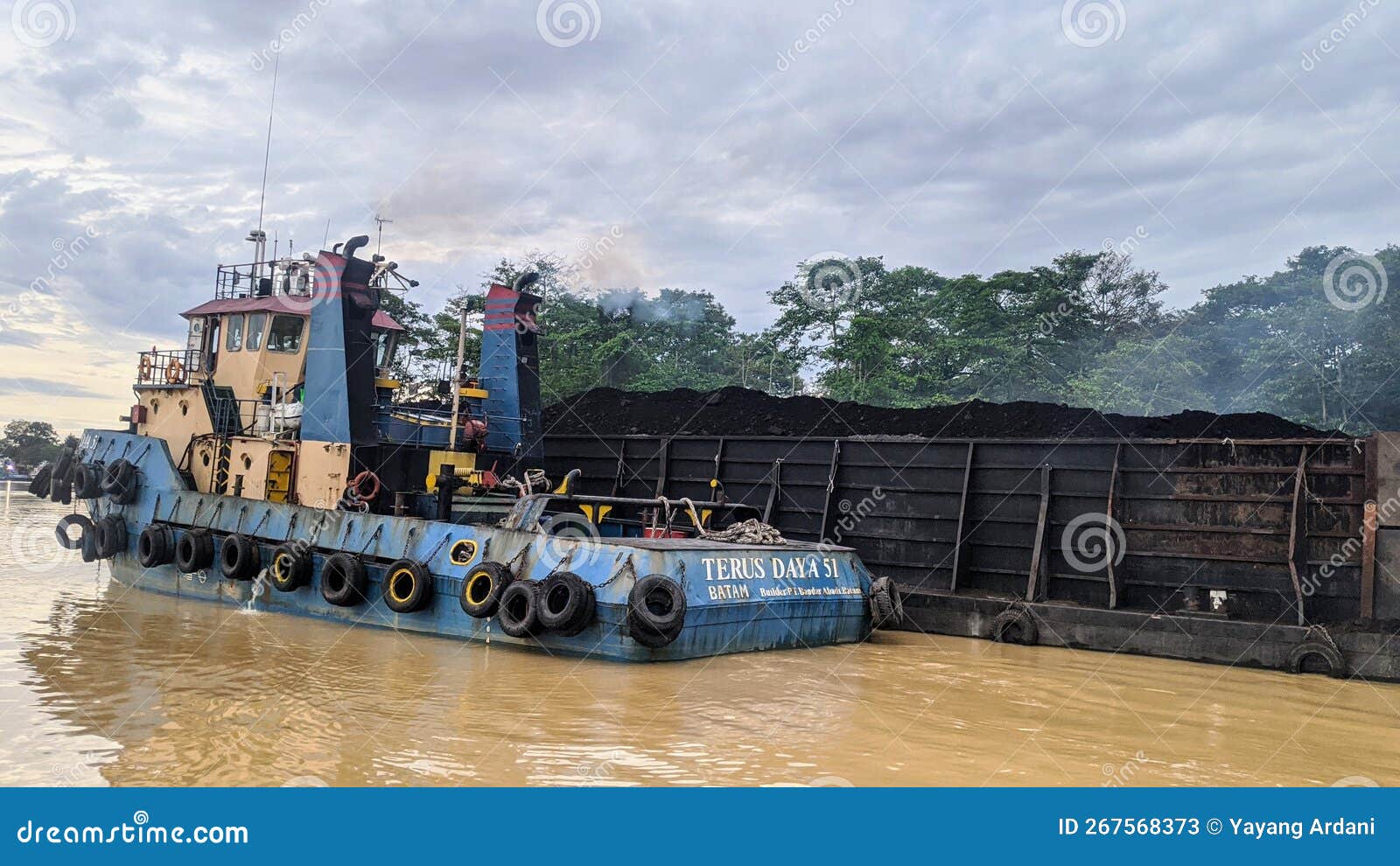 Tug Boat beside a Barge Loaded with Coal on the Batanghari River ...