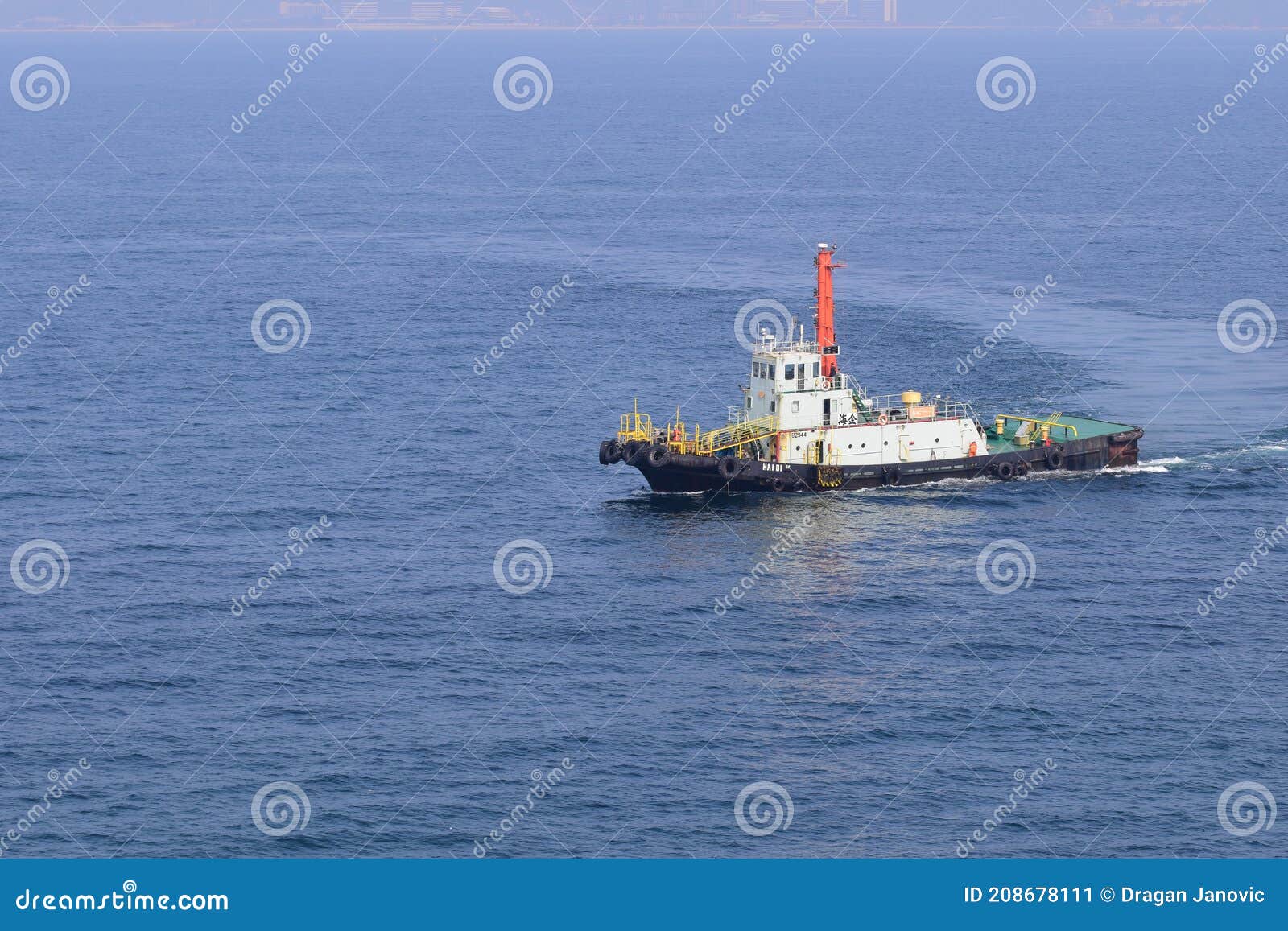 Tug boat maneuvering stock image. Image of approach - 208678111
