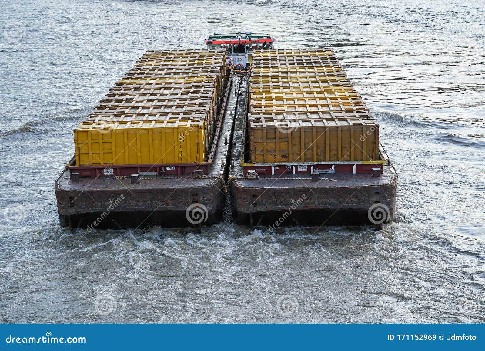 Tug Boat is Pulling Two Wessels Full of Containers on the Thames River ...