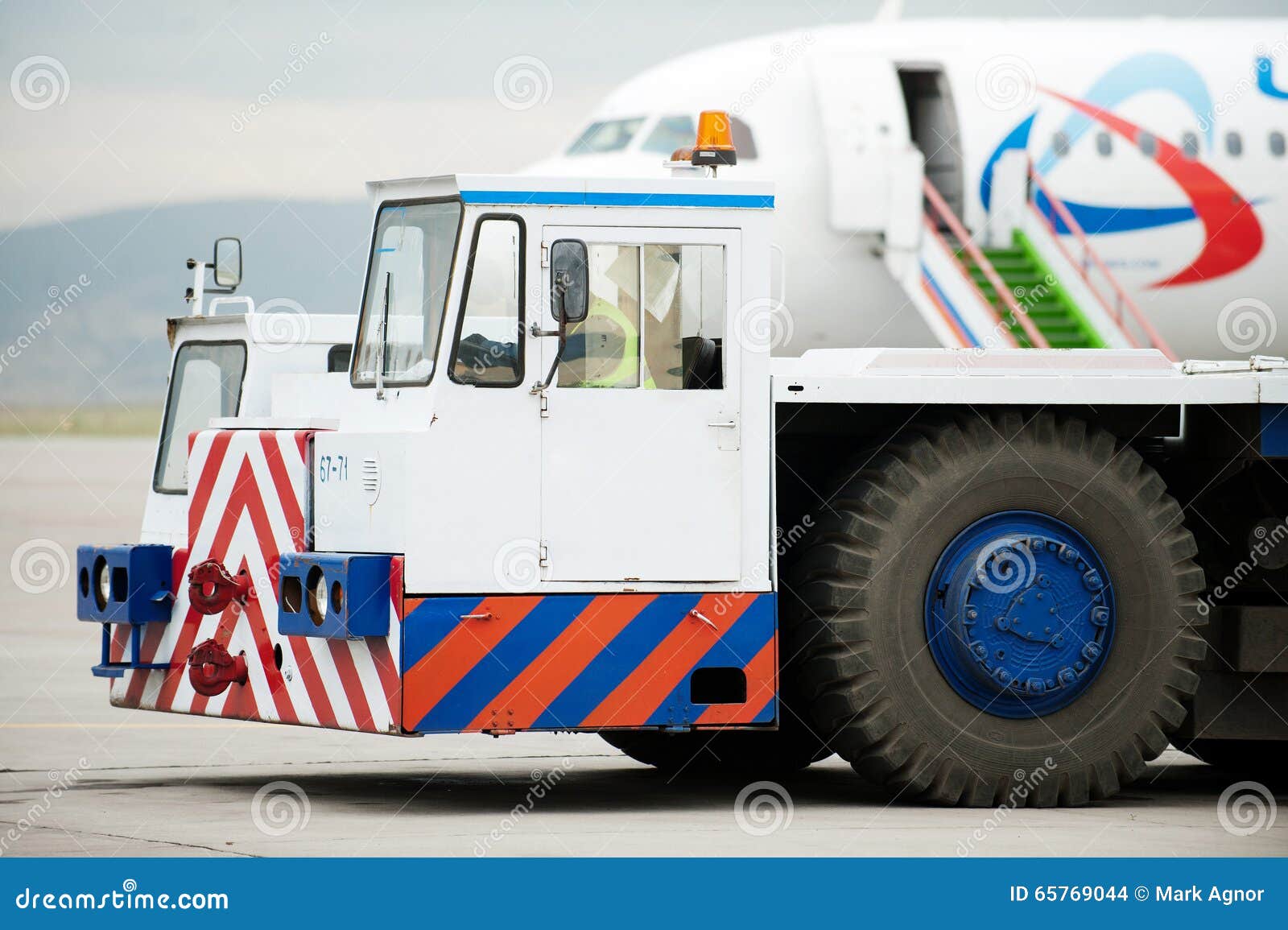 Tug Pushback Tractor In The Airport. Editorial Photo | CartoonDealer ...