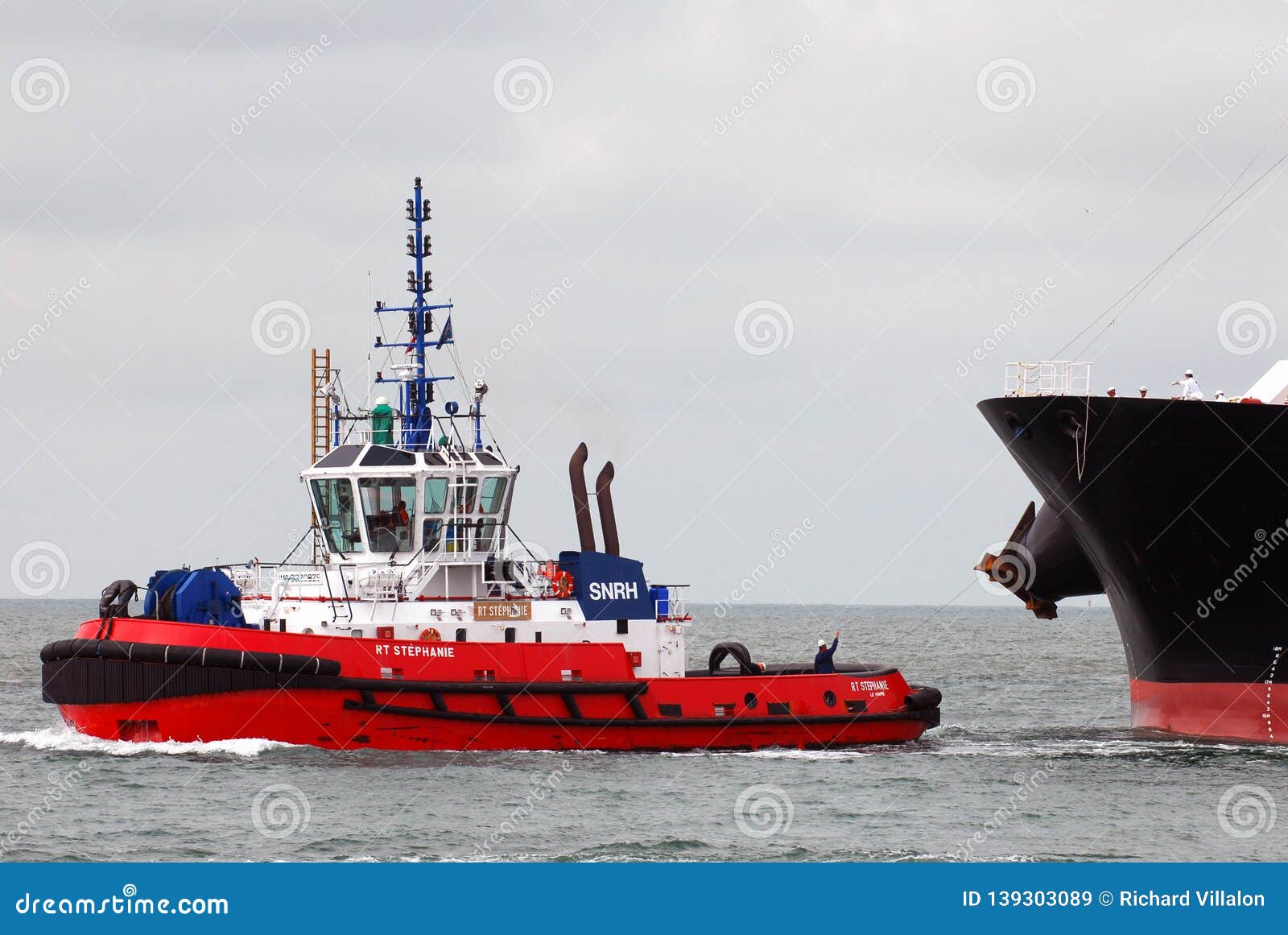 Tug towing a cargo ship editorial stock image. Image of export - 139303089 Tug towing a cargo ship editorial stock image. Image of export - 139303089