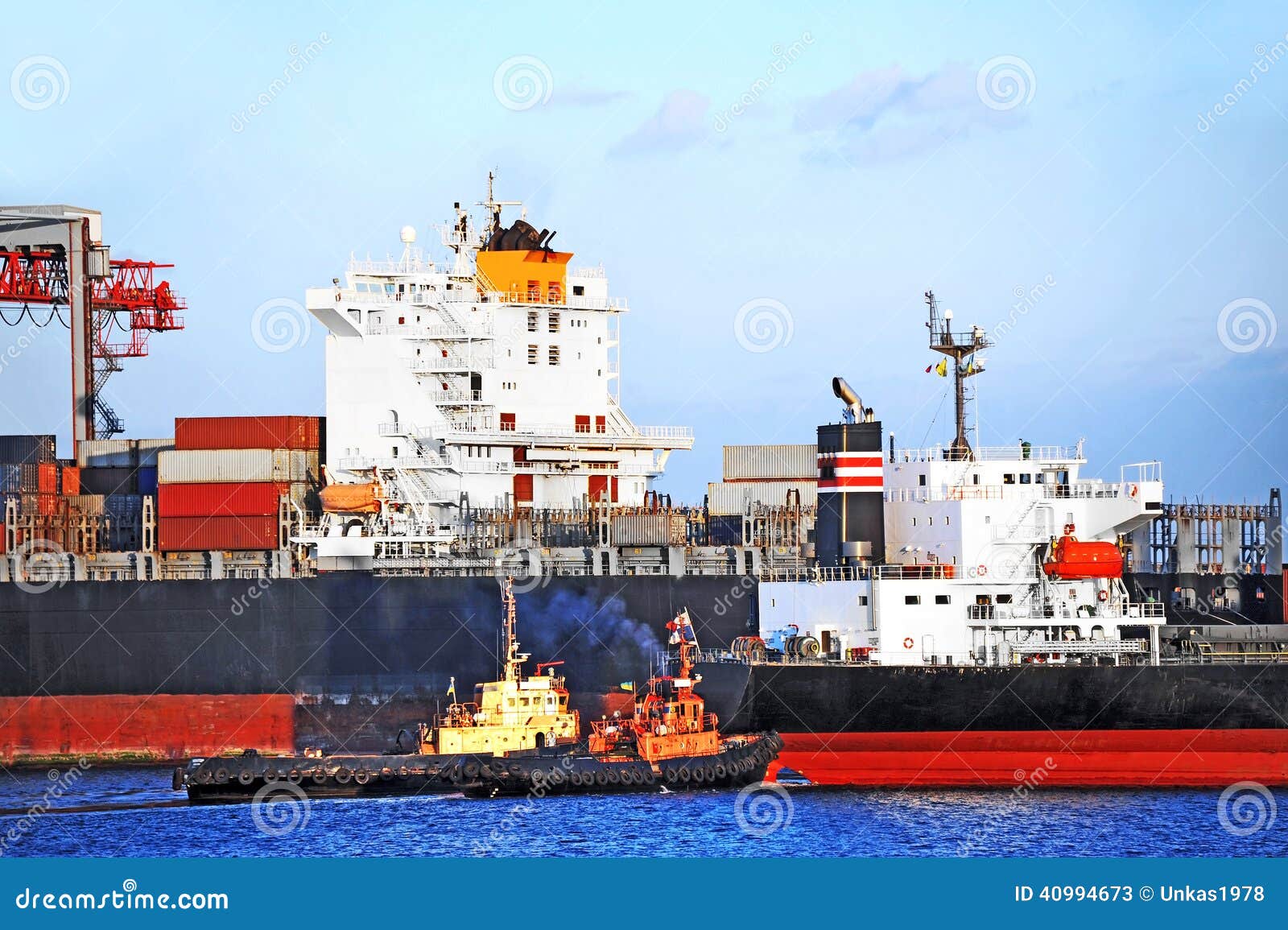 Tugboat Assisting Container Cargo Ship Stock Image - Image of quayside ...