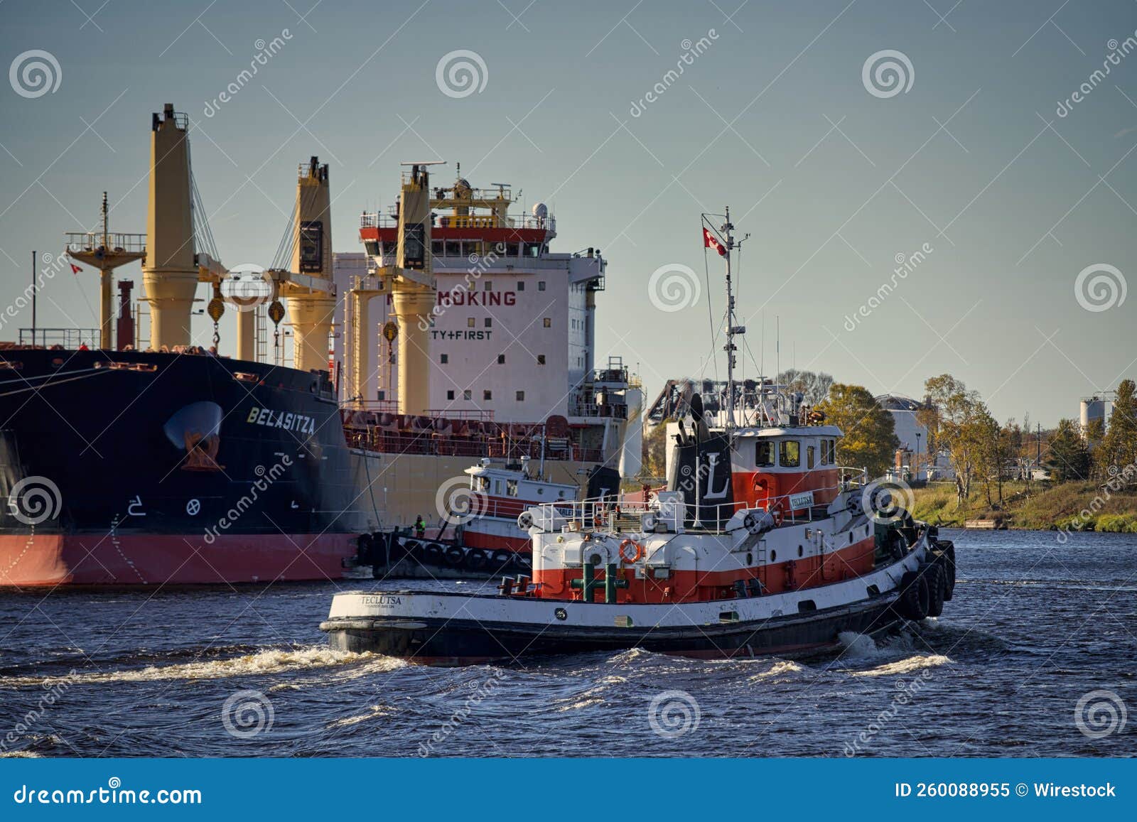 Tugboat Assisting an Ocean-going Vessel in the Port of Thunder Bay ...