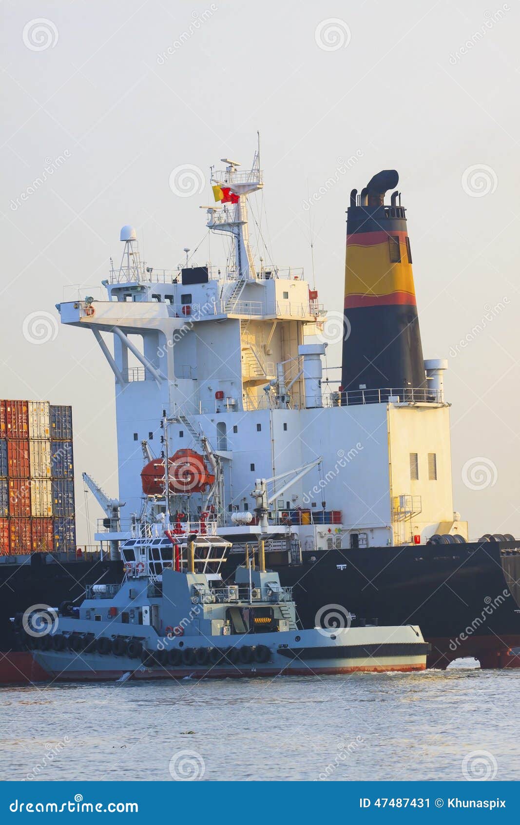 Tugboat beside Big Container Ship in Vessel River Line Stock Image ...