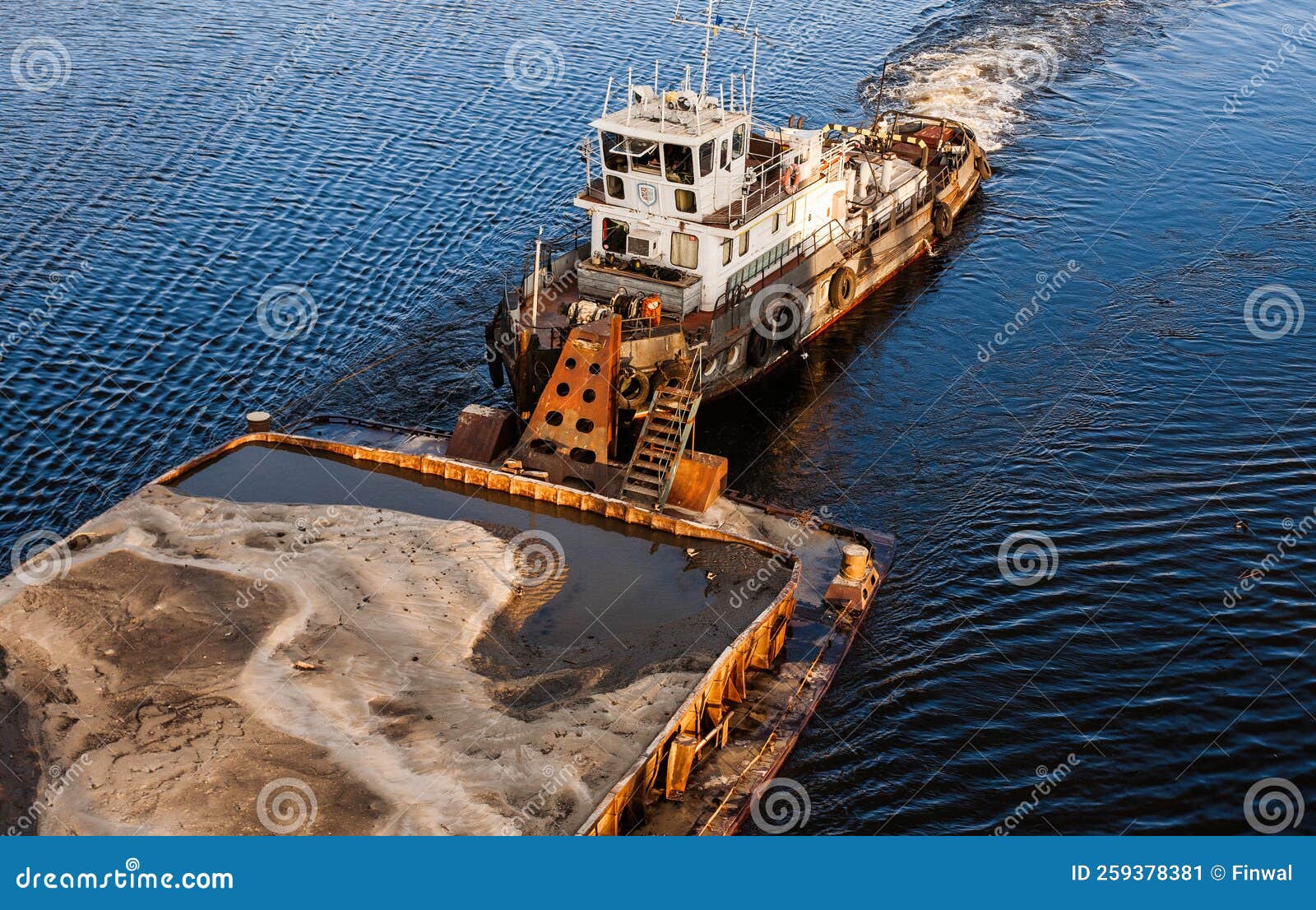 Tugboat pushing barge stock image. Image of container - 259378381