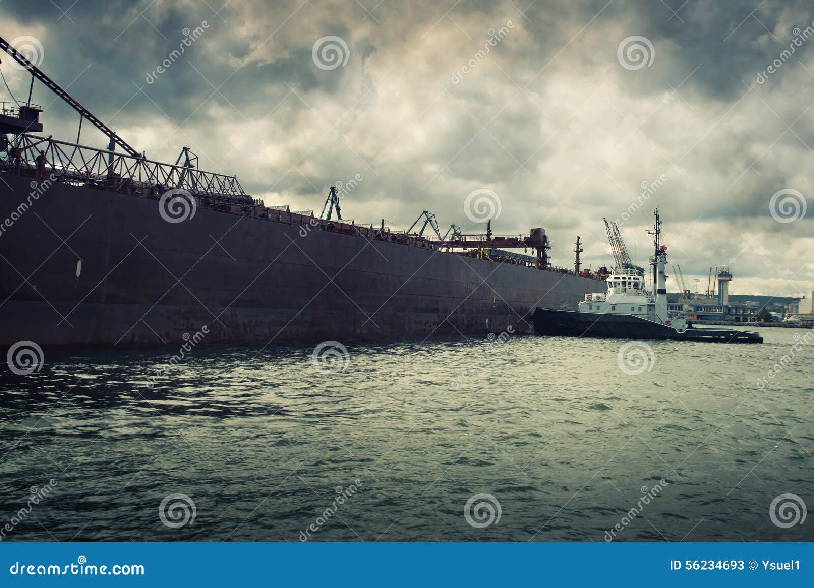 Tugboat pushing a ship stock image. Image of polish, power - 56234693
