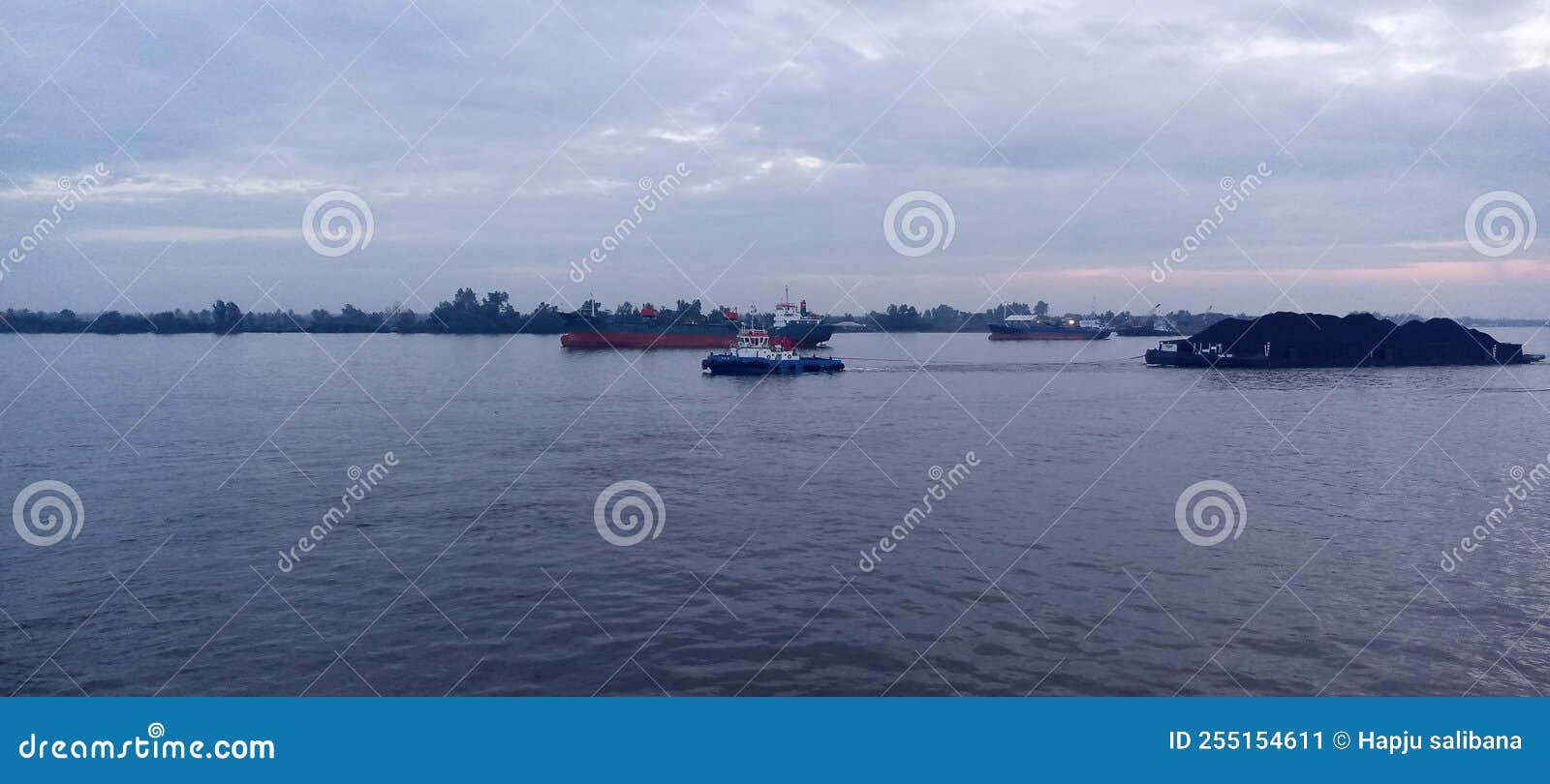 Tugboat Towing Full Loaded Cargo Ship From Port Royalty-Free Stock ... Tugboat Towing Full Loaded Cargo Ship From Port Royalty-Free Stock ...
