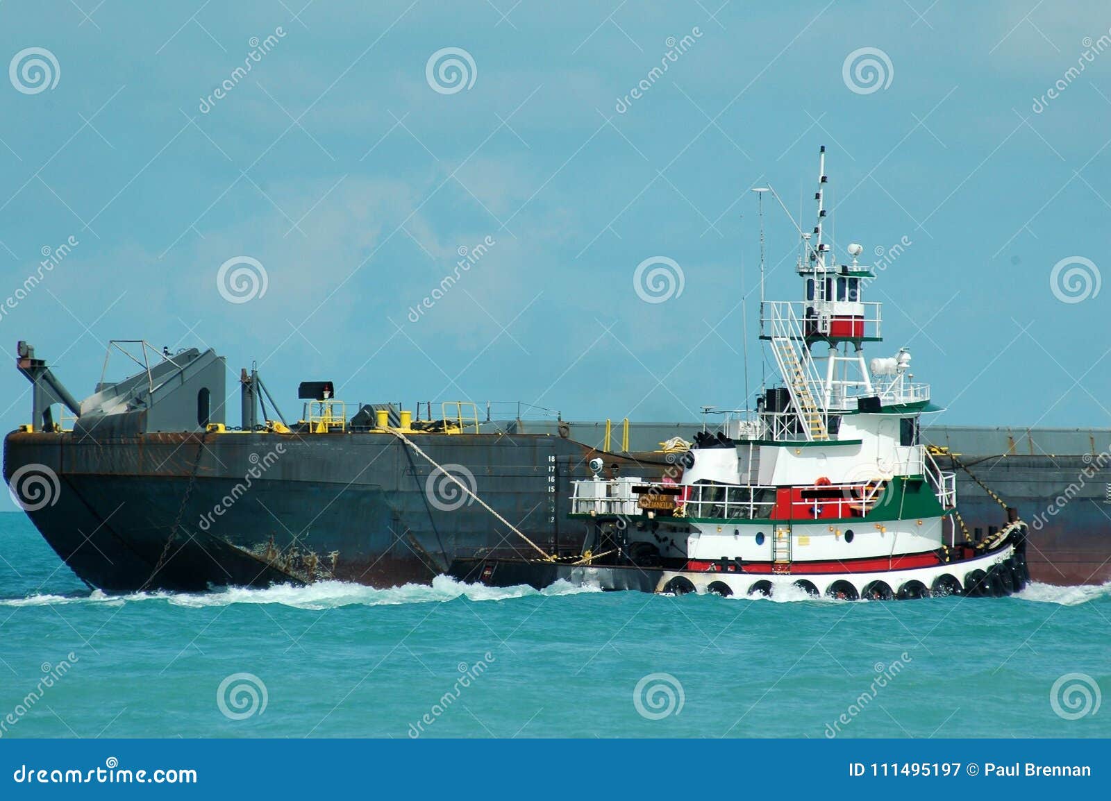 Tugboat Towing Full Loaded Cargo Ship From Port Royalty-Free Stock ... Tugboat Towing Full Loaded Cargo Ship From Port Royalty-Free Stock ...