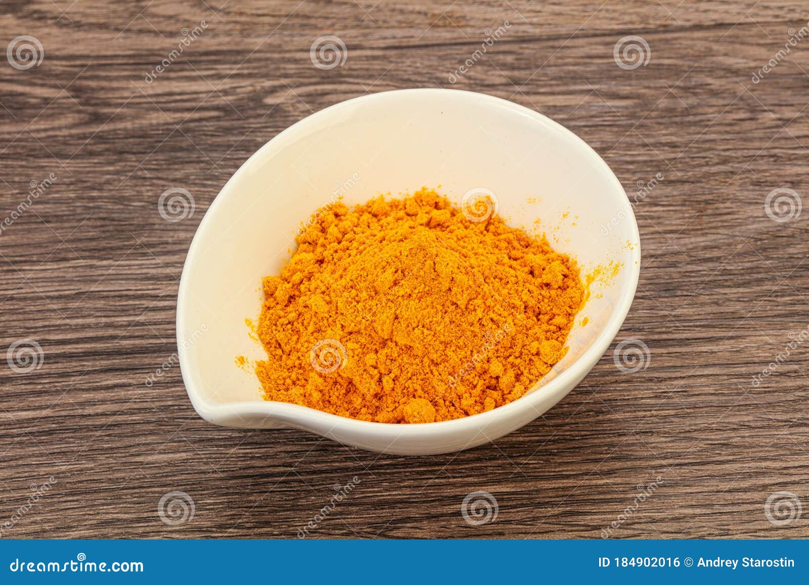 Tumeric powder in the bowl stock photo. Image of spicy - 184902016