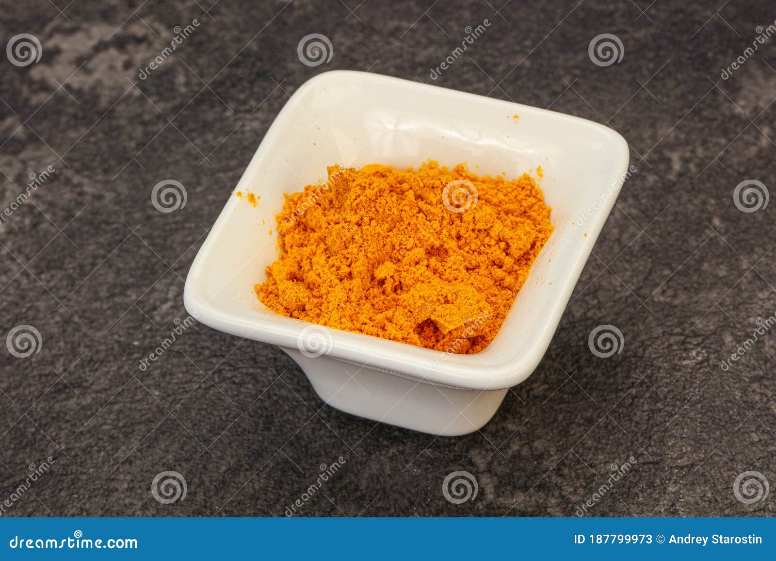 Tumeric powder in the bowl stock image. Image of flavoring - 187799973