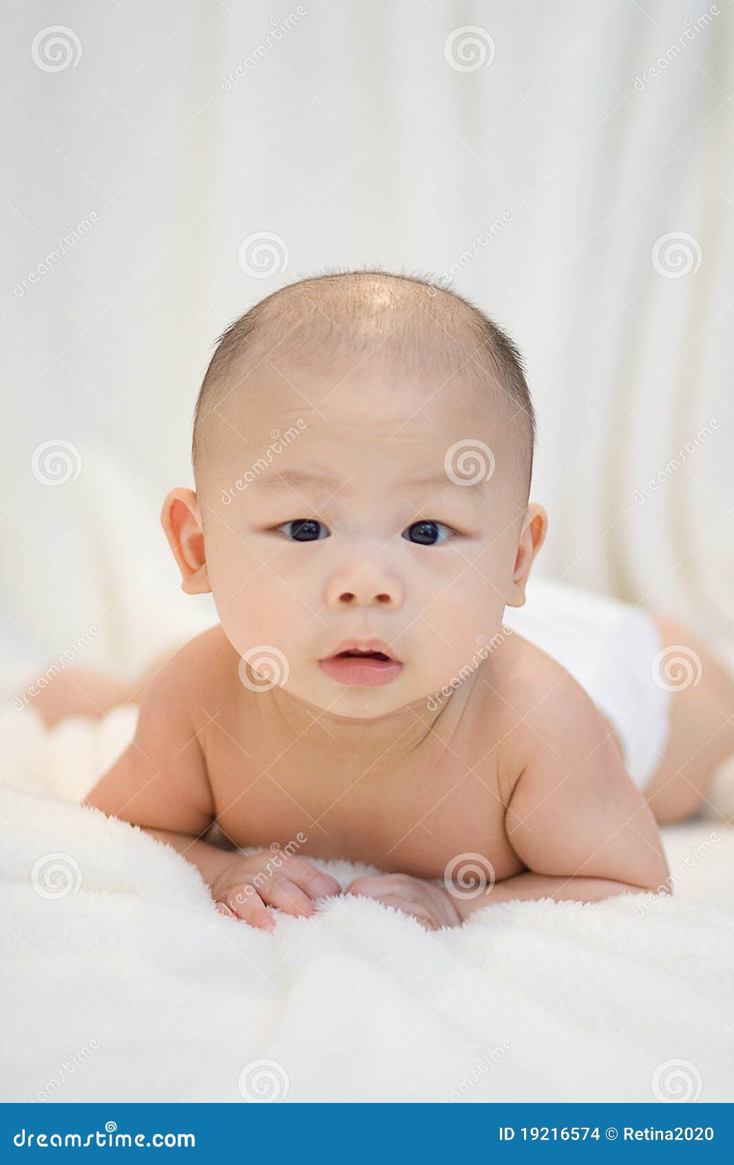 Tummy Time stock photo. Image of thumbs, hand, onesie - 19216574