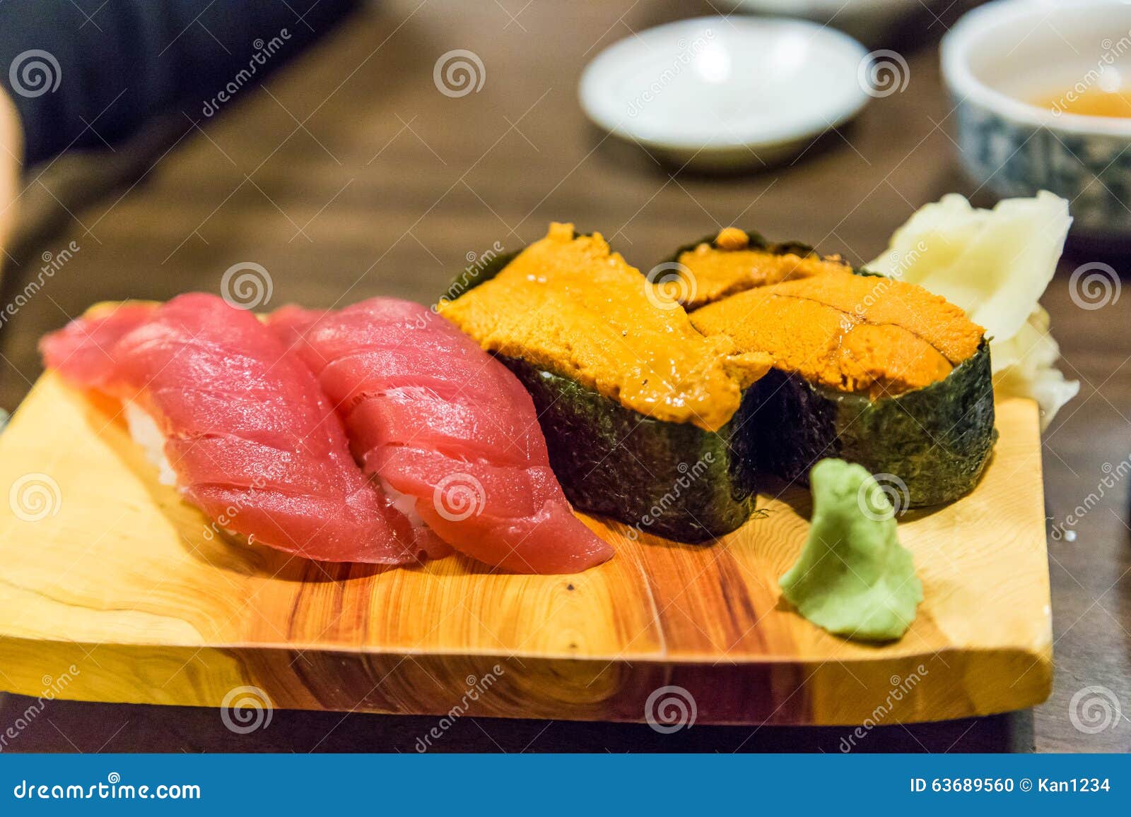 Sea Urchin Sushi Wrapped In Seaweed On A Traditional Japanese Dish In A ...