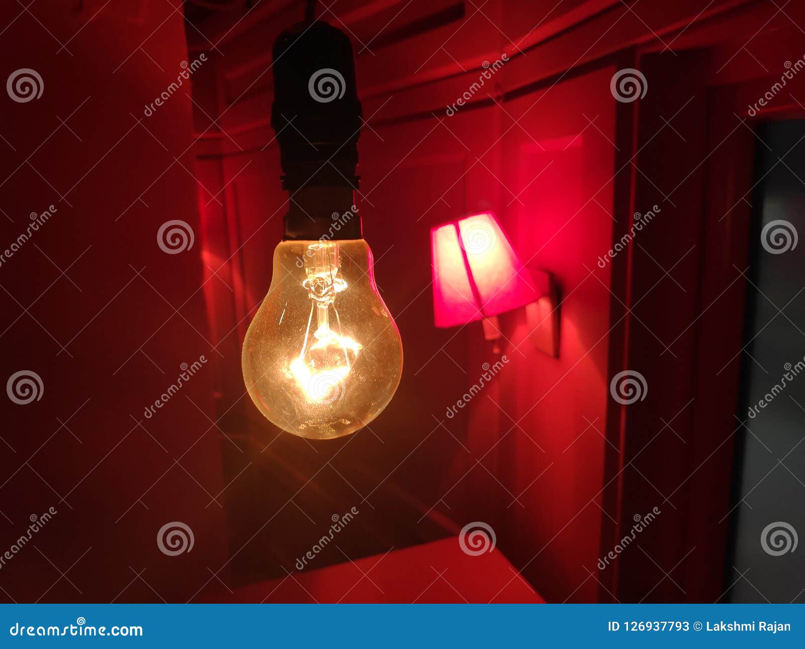 Light bulb in red room stock image. Image of light, bulb - 126937793